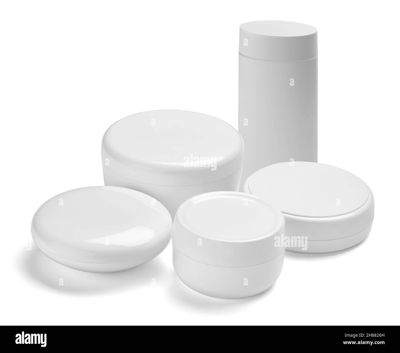 close up of a white beauty cream container and tube on white background ...