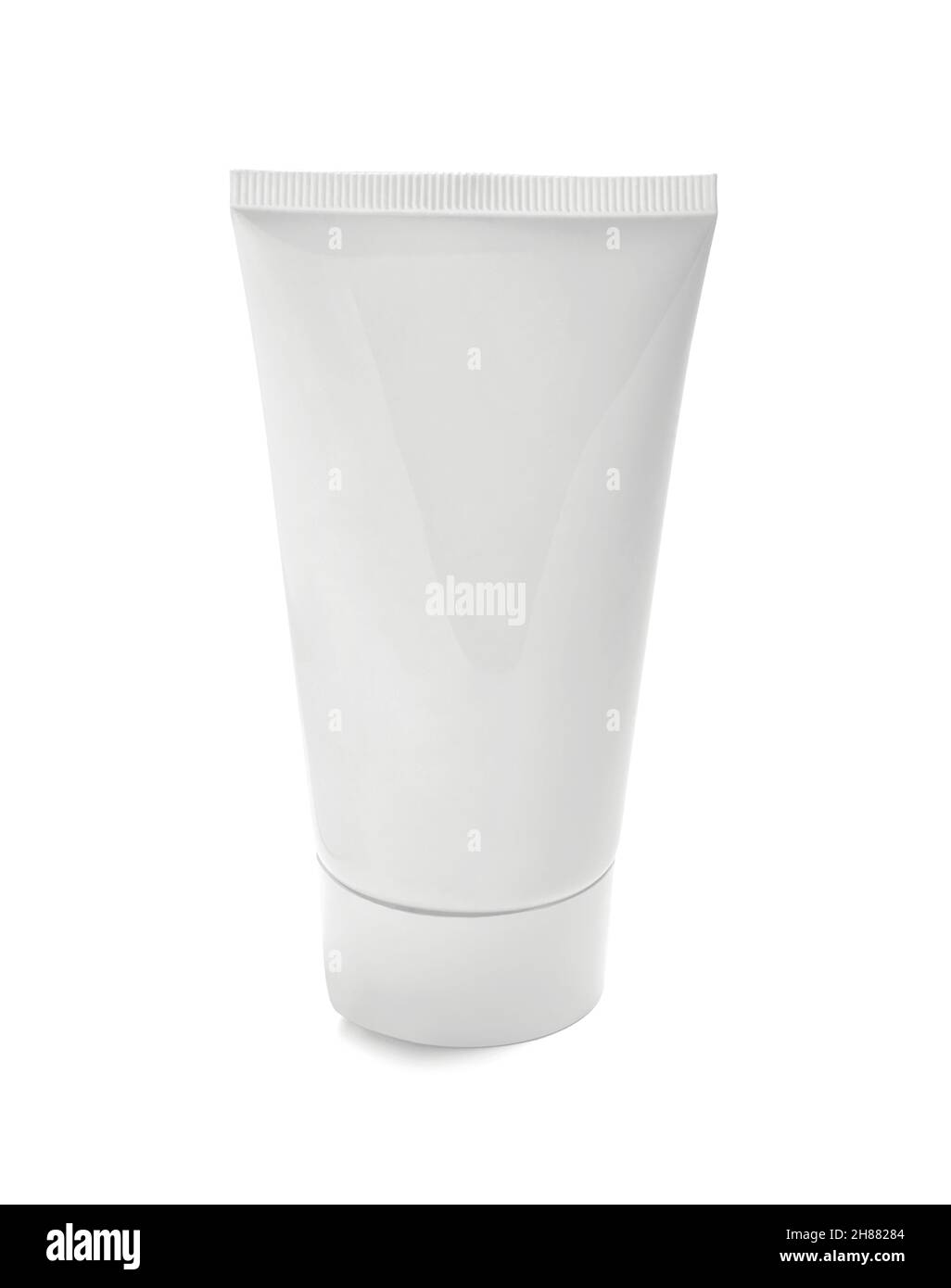 close up of a white beauty cream or a toothpaste tube on white ...