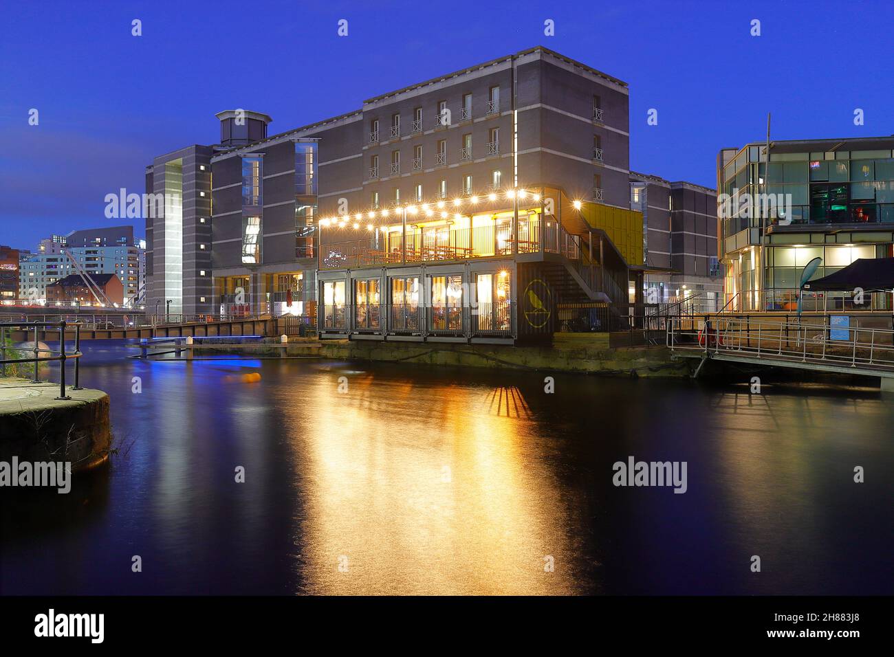 Leeds Dock at night with the new Canary Bar & Kitchen Stock Photo - Alamy