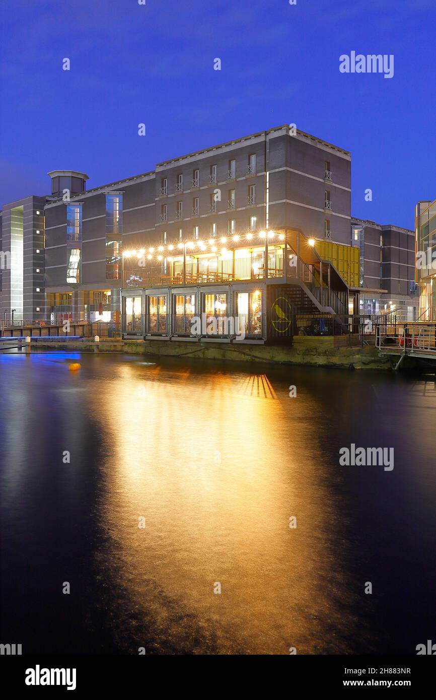 Leeds Dock at night with the new Canary Bar & Kitchen Stock Photo - Alamy