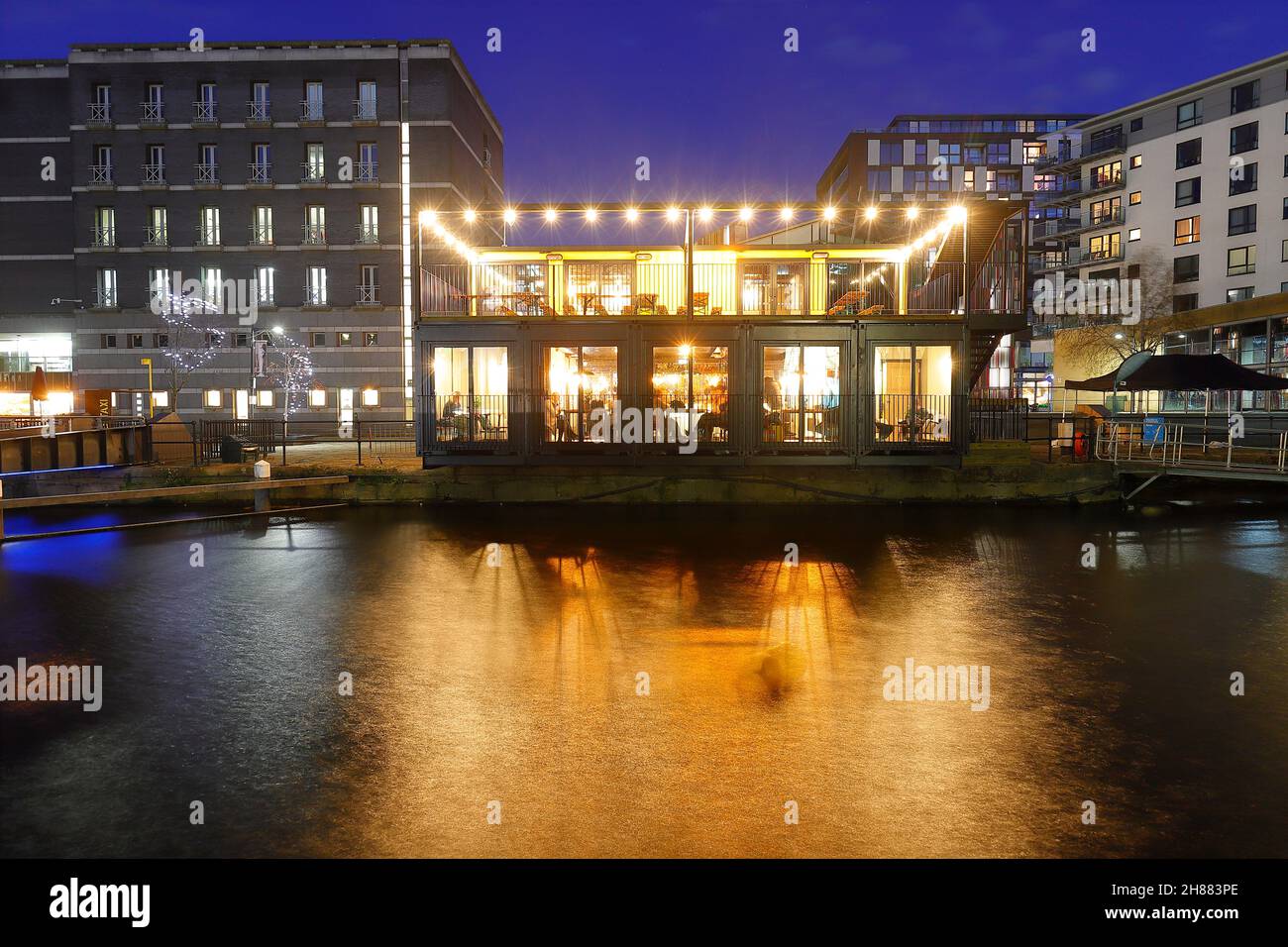 Leeds Dock at night with the new Canary Bar & Kitchen Stock Photo - Alamy