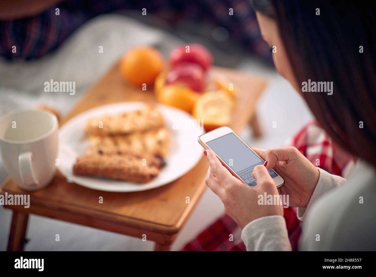 Young Girl texting message at mobile phone in morning Stock Photo - Alamy