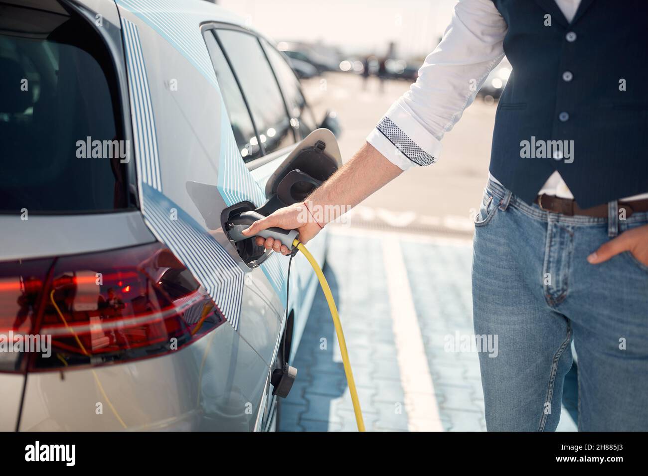 Electric car charging.Loading energy of an electric car Stock Photo - Alamy