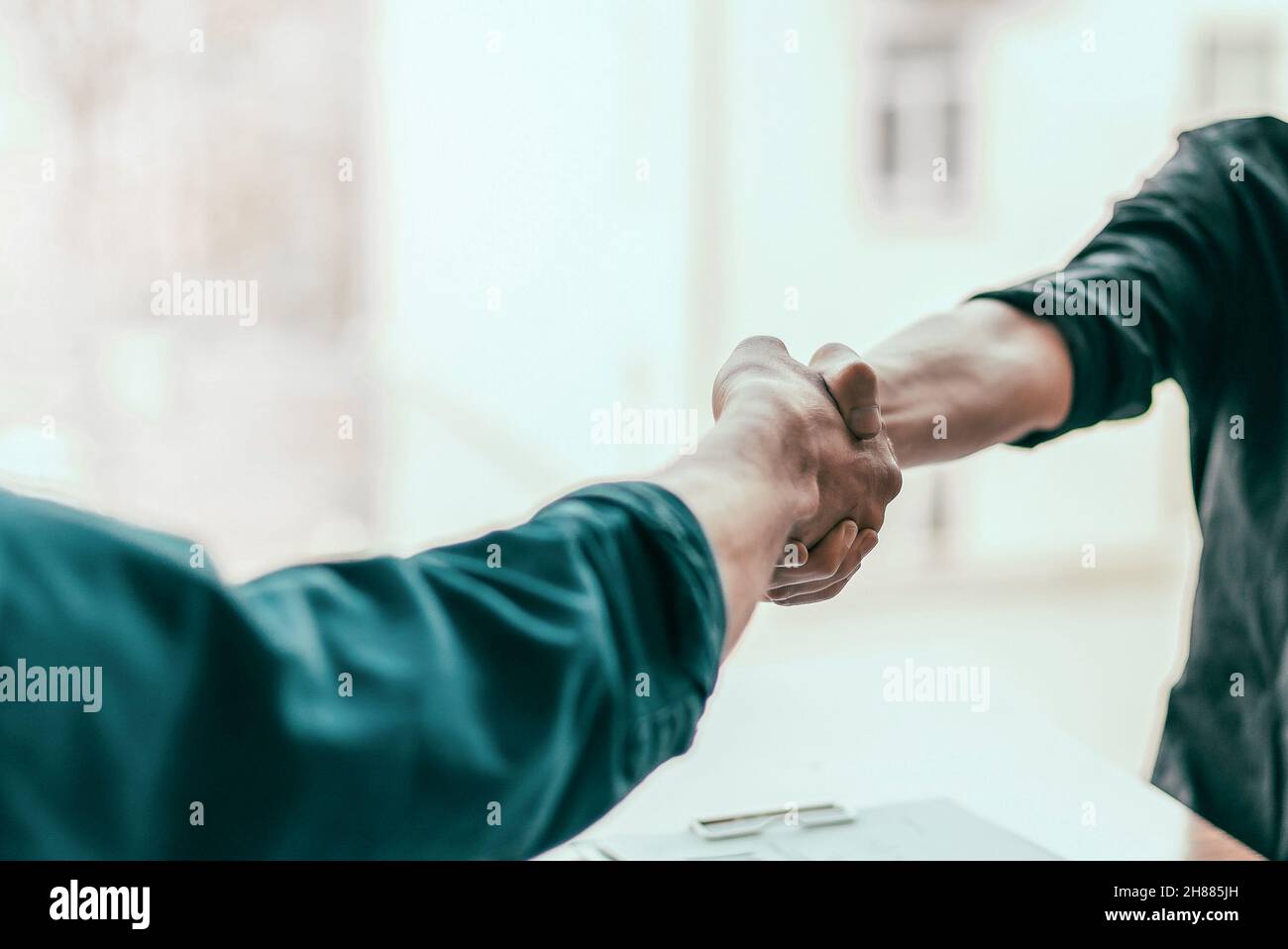 close up. financial partners are shaking hands with each other ...