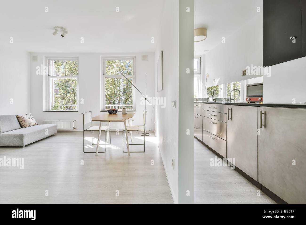 The wall separating the two rooms into a kitchen and a dining room ...