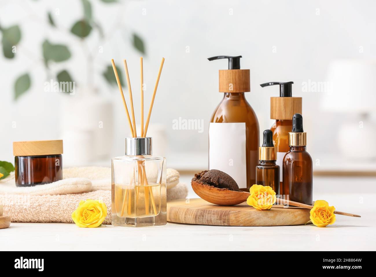 Spa set with aroma diffuser on light background Stock Photo - Alamy