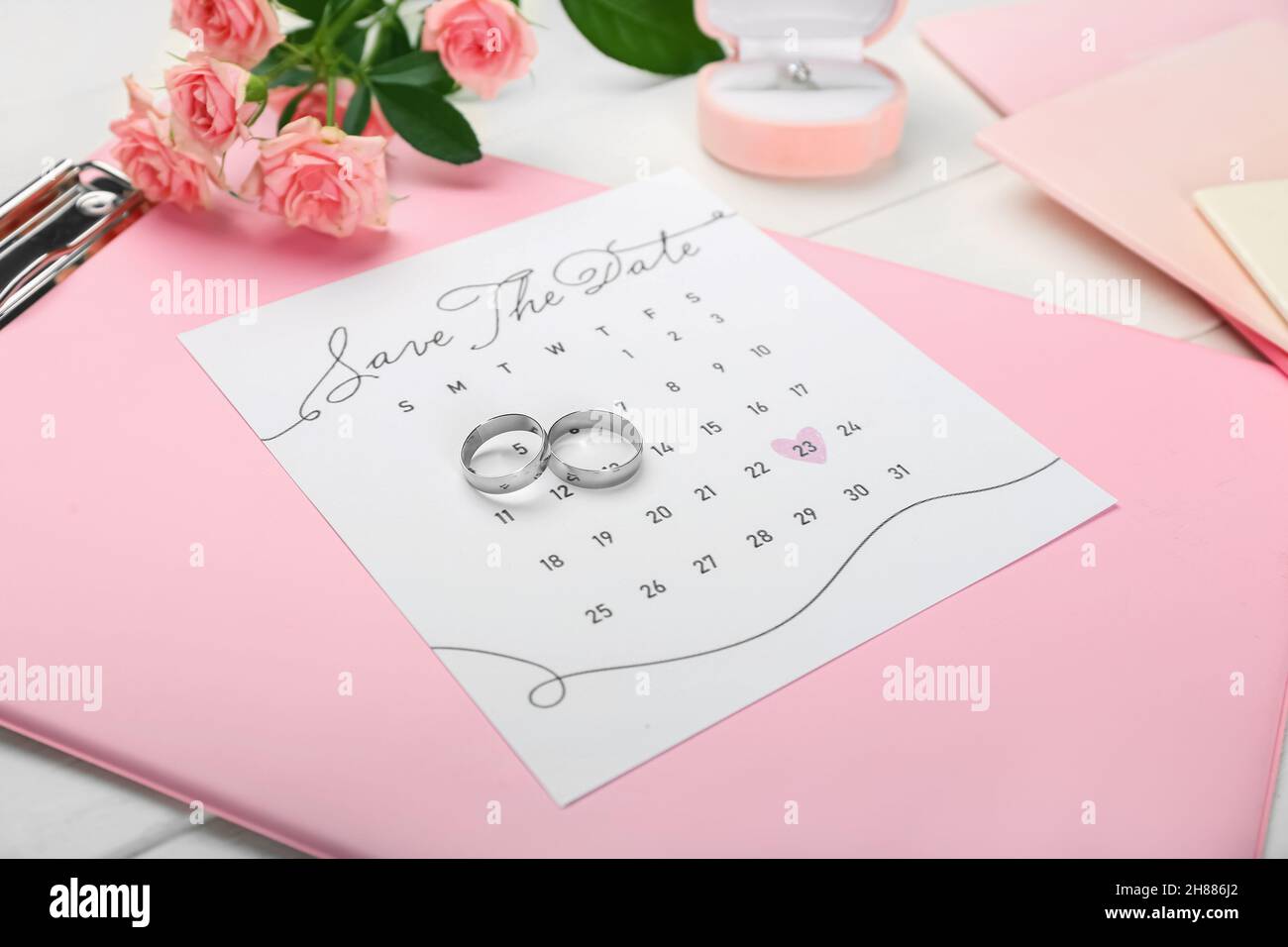 Beautiful composition with wedding calendar on table Stock Photo - Alamy
