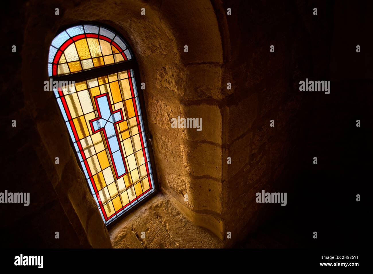 Stained glass window with a latin cross Stock Photo - Alamy