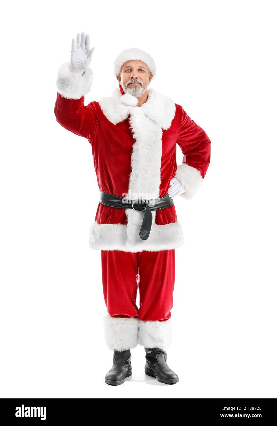 Santa Claus waving hand on white background Stock Photo - Alamy