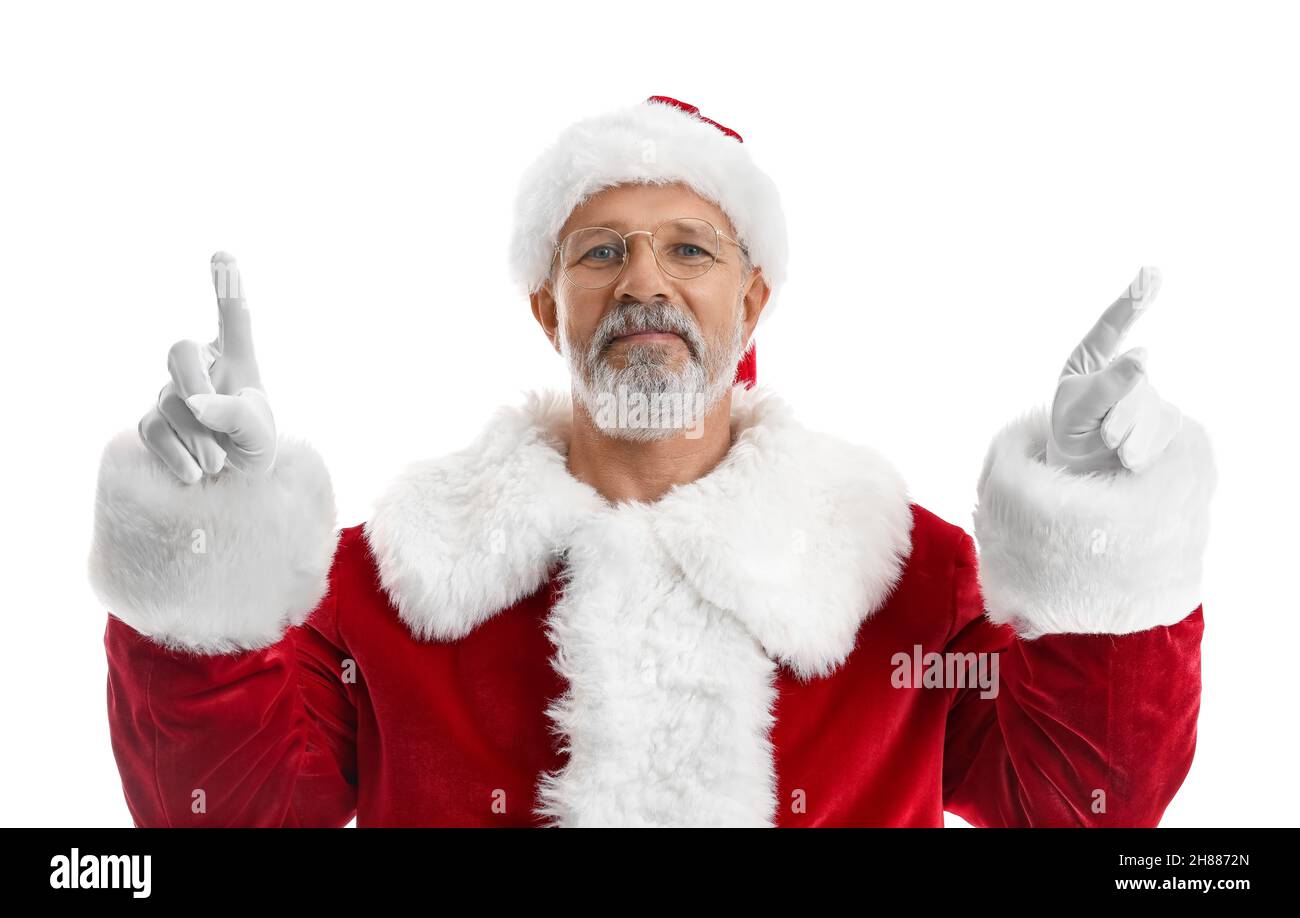 Santa Claus pointing at something on white background Stock Photo - Alamy