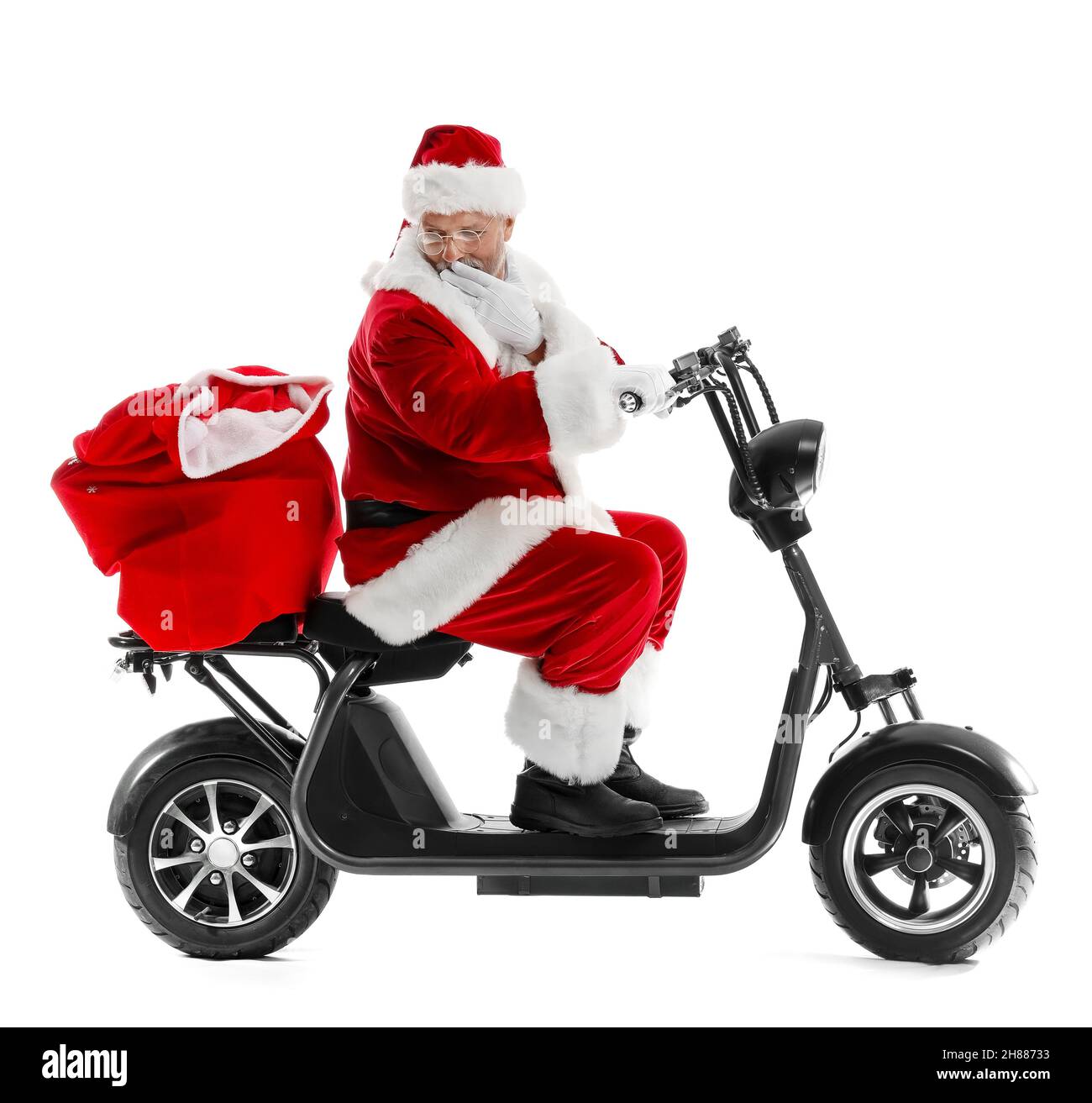Surprised Santa Claus riding electric scooter on white background Stock ...