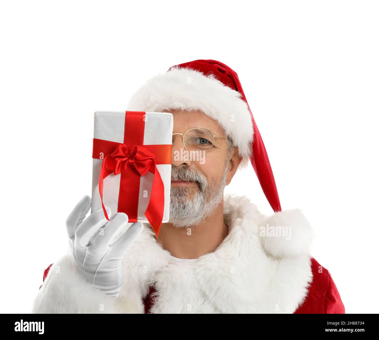 Santa Claus holding gift box on white background Stock Photo - Alamy