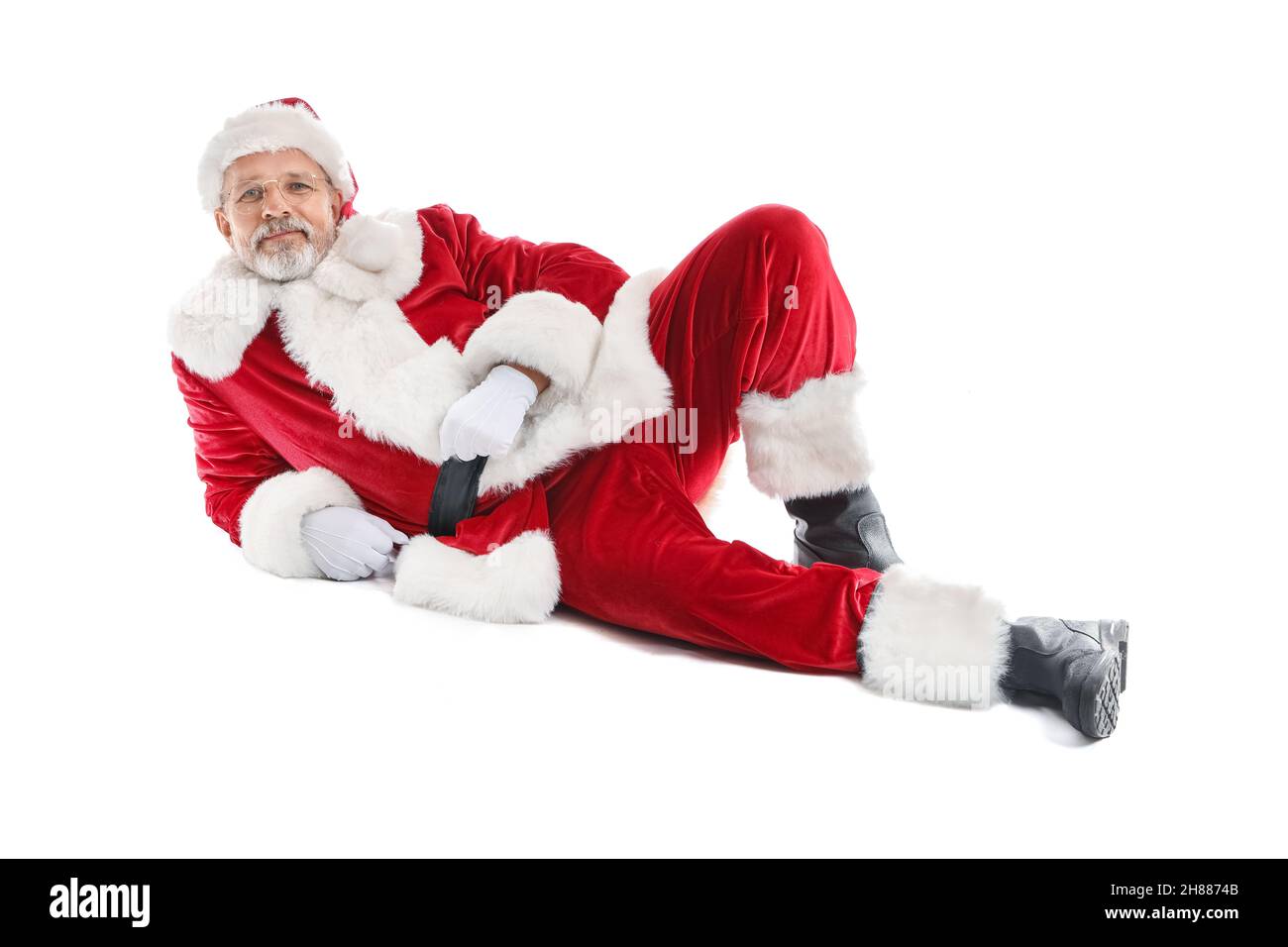 Santa Claus lying on white background Stock Photo - Alamy