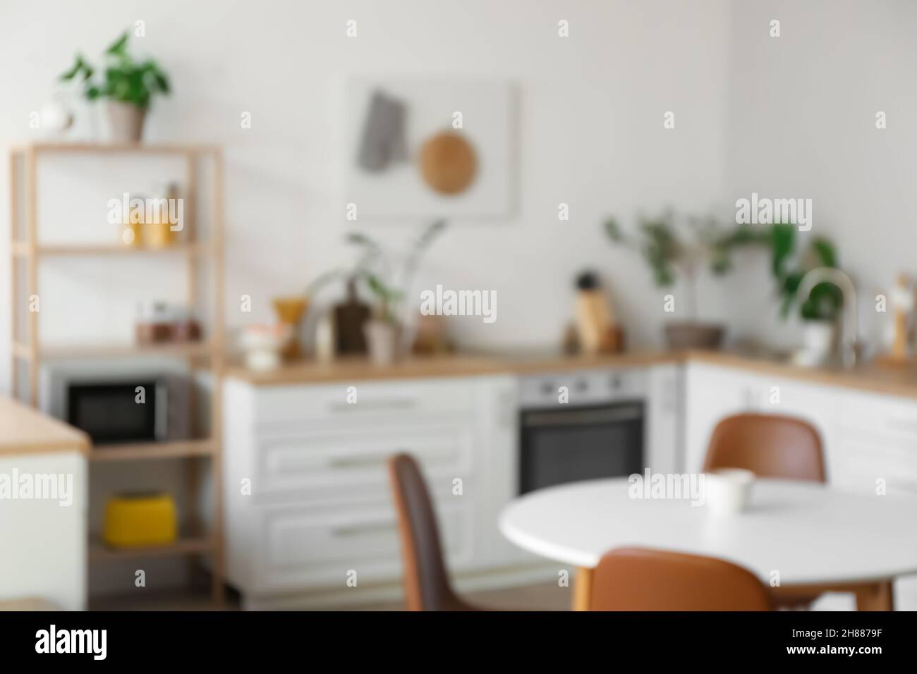 Interior of light modern kitchen, blurred view Stock Photo - Alamy