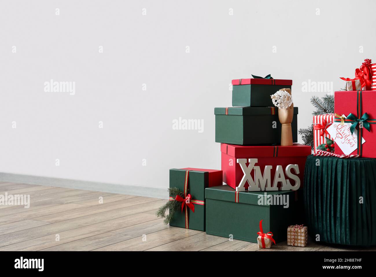 Christmas gift boxes, decor and word XMAS on floor Stock Photo - Alamy