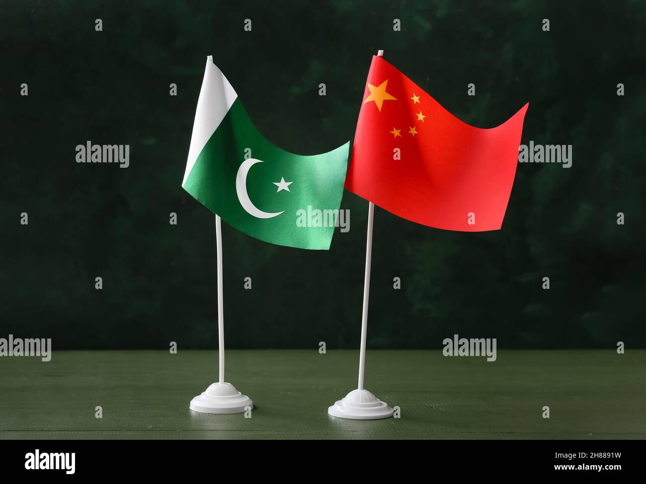 Flags of China and Pakistan on green background Stock Photo - Alamy