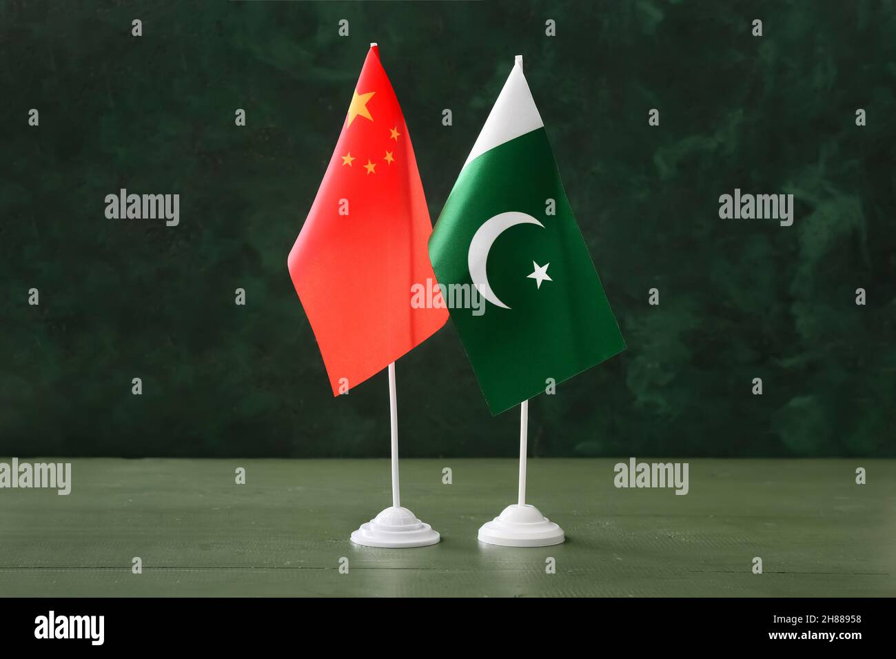 Flags of China and Pakistan on green background Stock Photo - Alamy