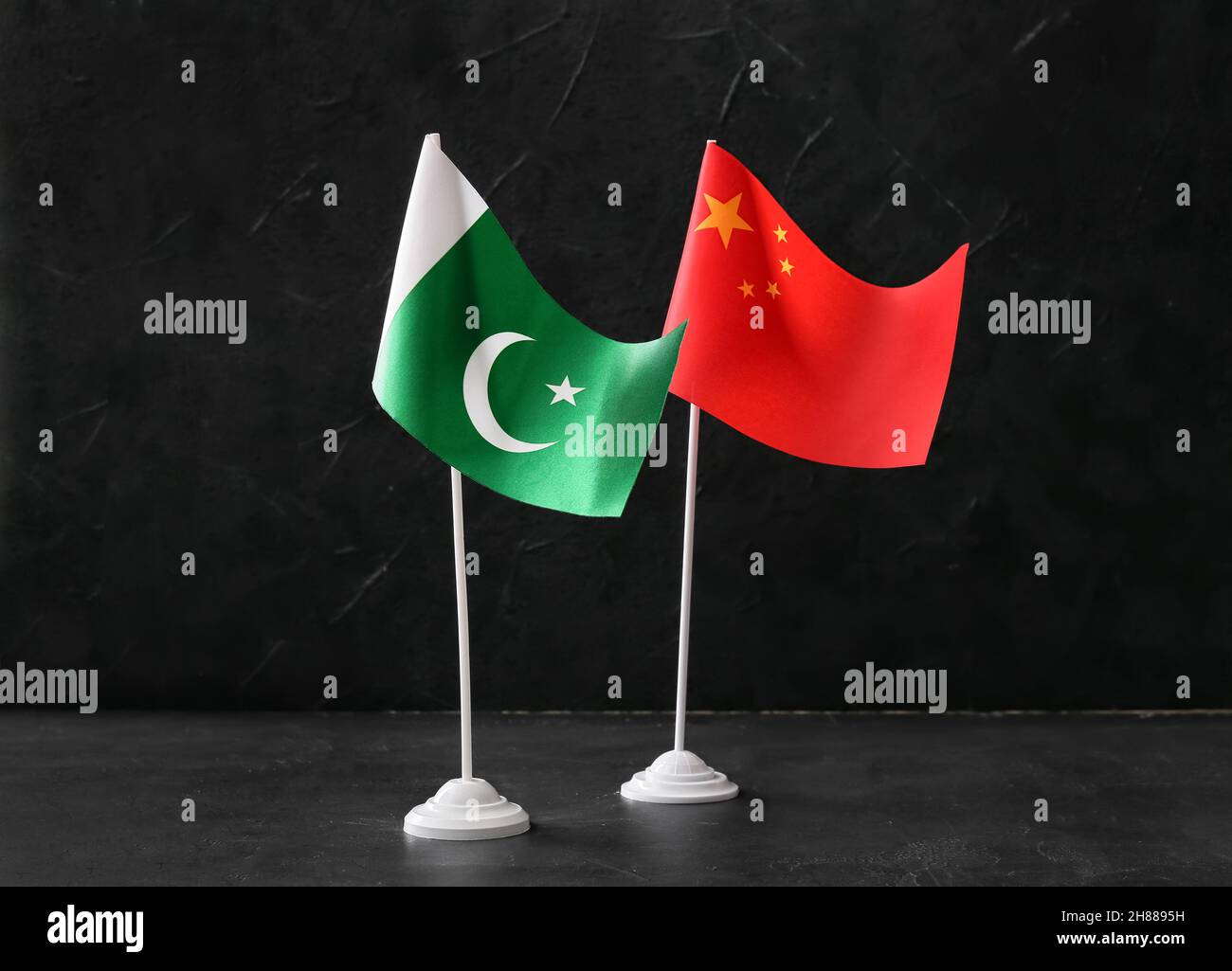 Flags of China and Pakistan on black background Stock Photo - Alamy