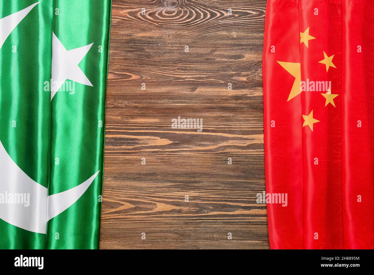 Flags of China and Pakistan on wooden background Stock Photo - Alamy
