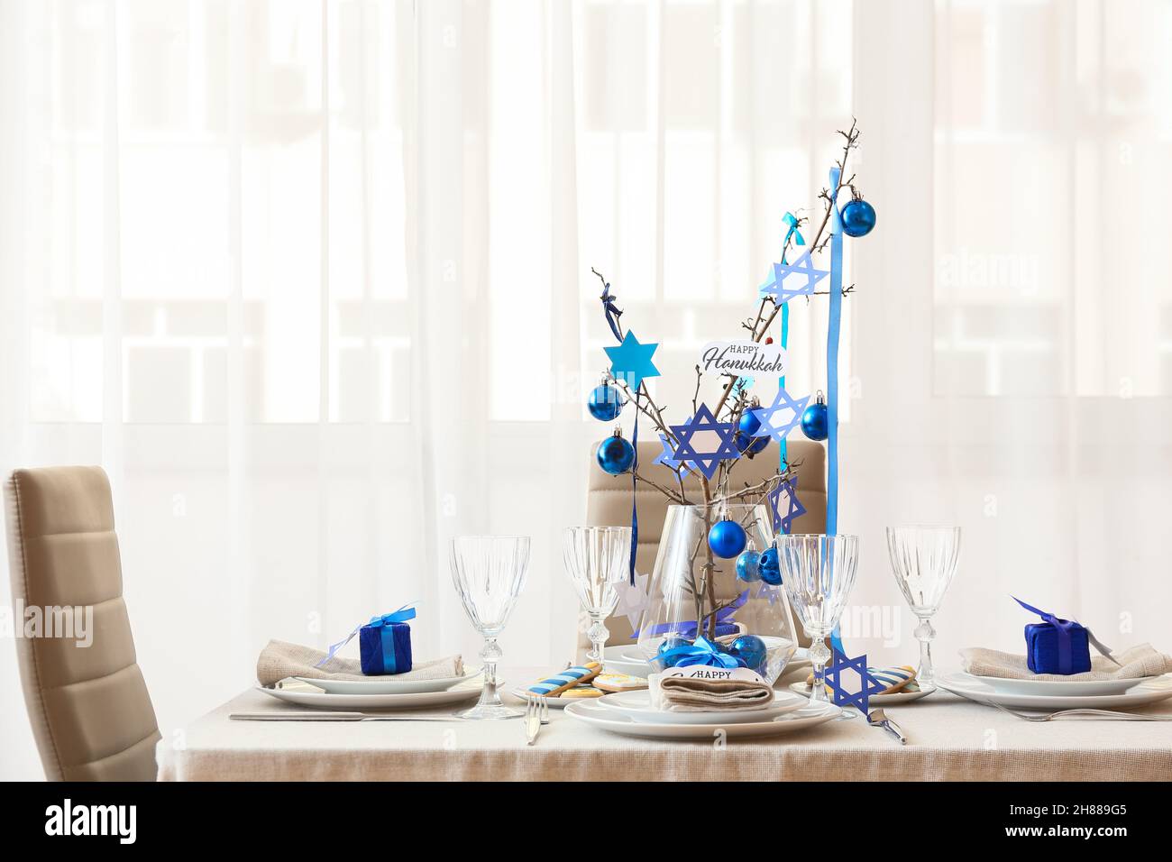 Beautiful table setting for Hanukkah celebration in dining room Stock ...