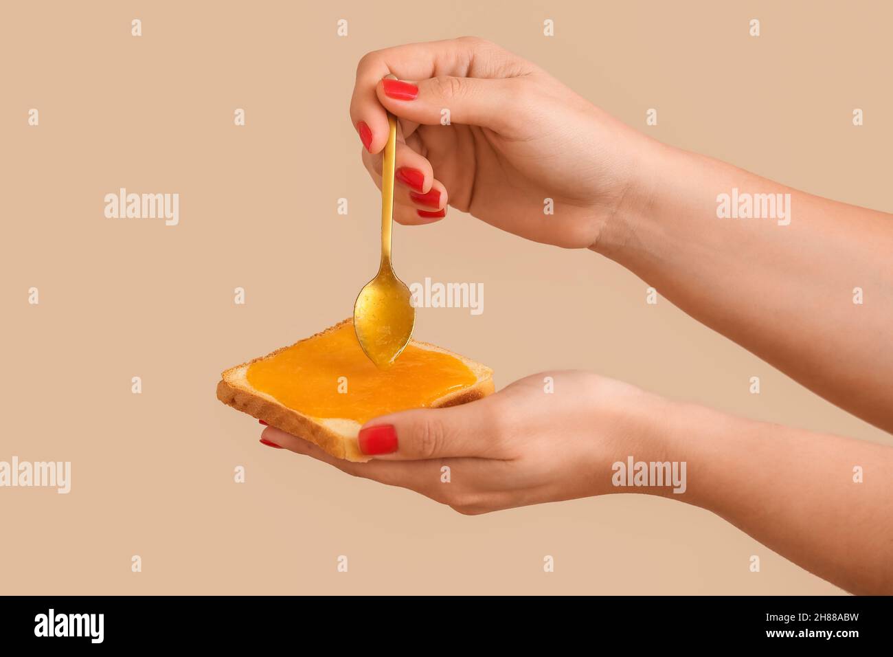 Hands female spreading jam toast hi-res stock photography and images ...