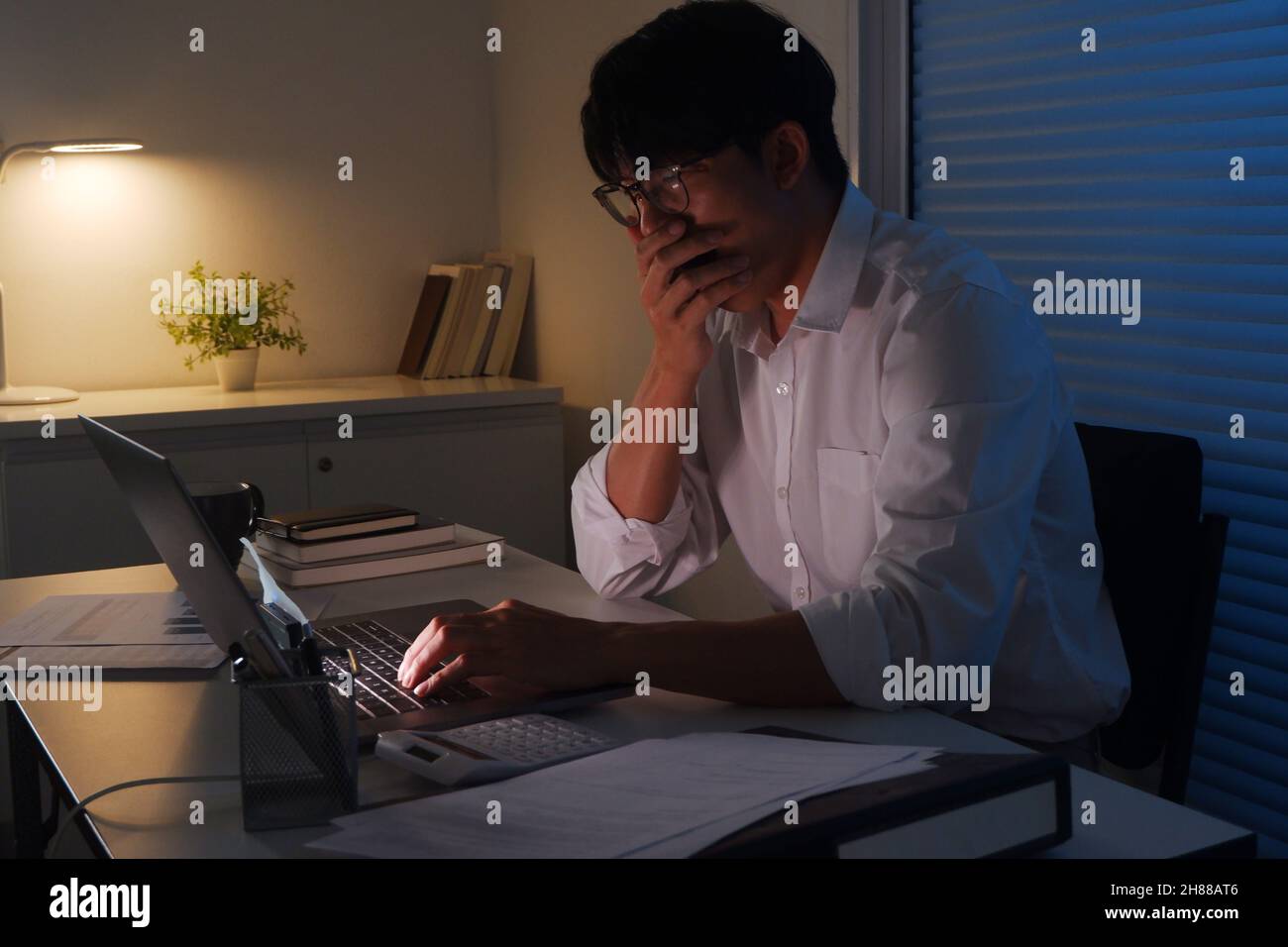 Working alone at night office hi-res stock photography and images - Alamy