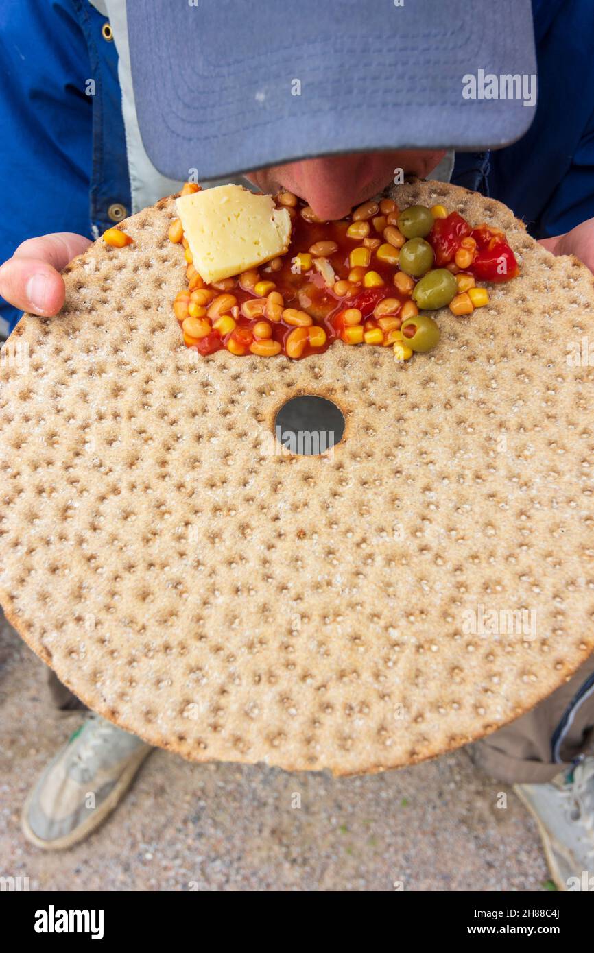 Young man eating beans model hi-res stock photography and images - Alamy