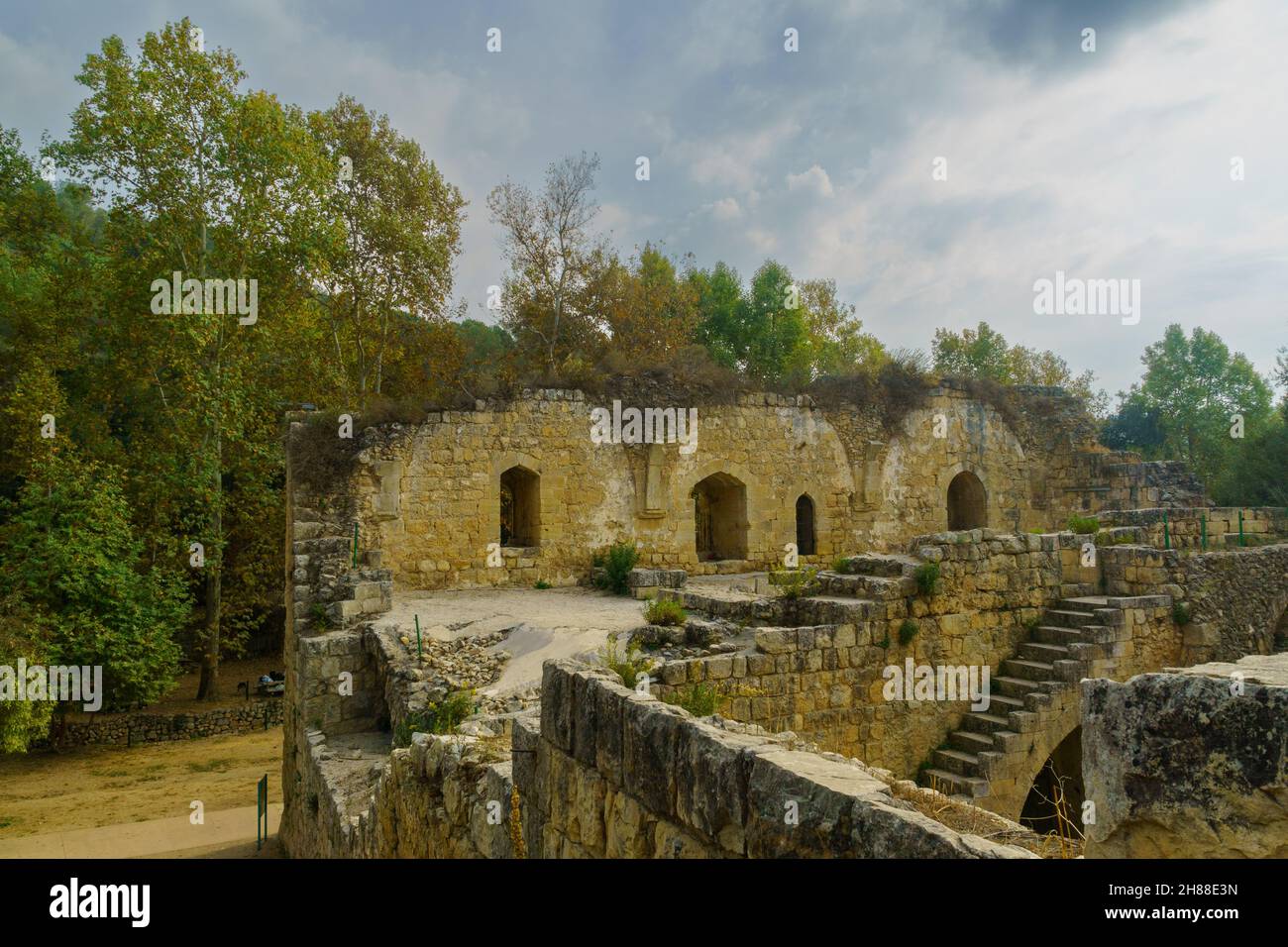 View of a Crusader farmhouse, with trees, and fall foliage in En Hemed ...
