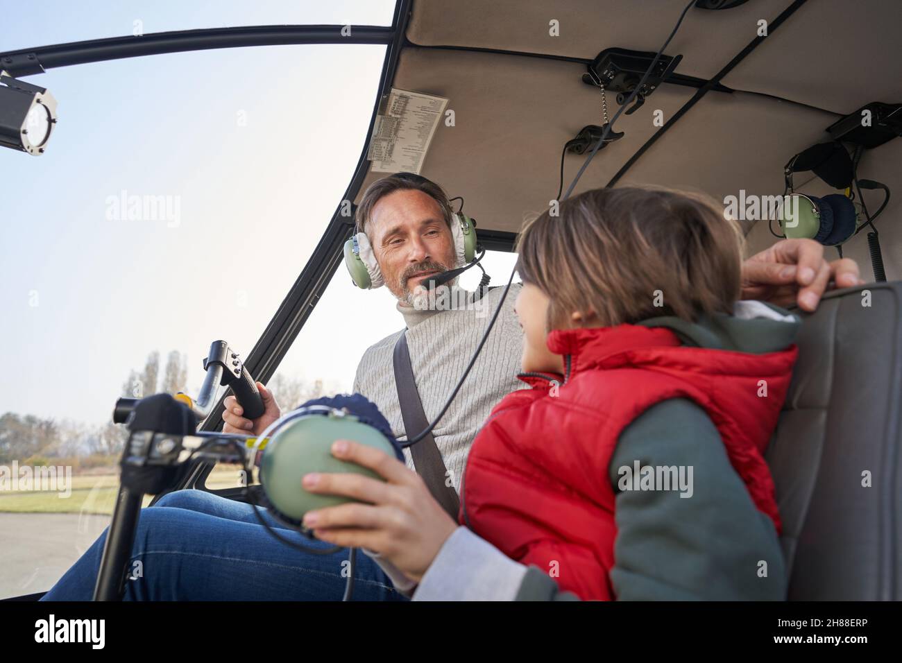 Helicopter flights are more fun with a co-pilot Stock Photo - Alamy