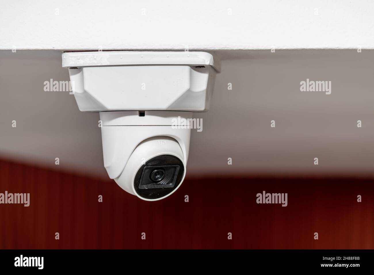 White ceiling mounted security camera with night vision Stock Photo - Alamy