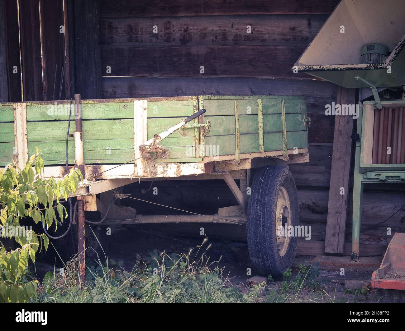 An old German tractor-trailer in a garden Stock Photo - Alamy
