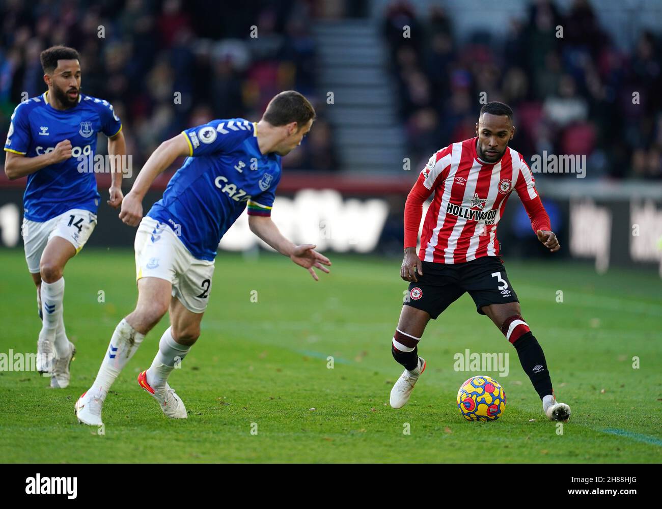 Brentford's c battle for the ball during the Premier League match at ...
