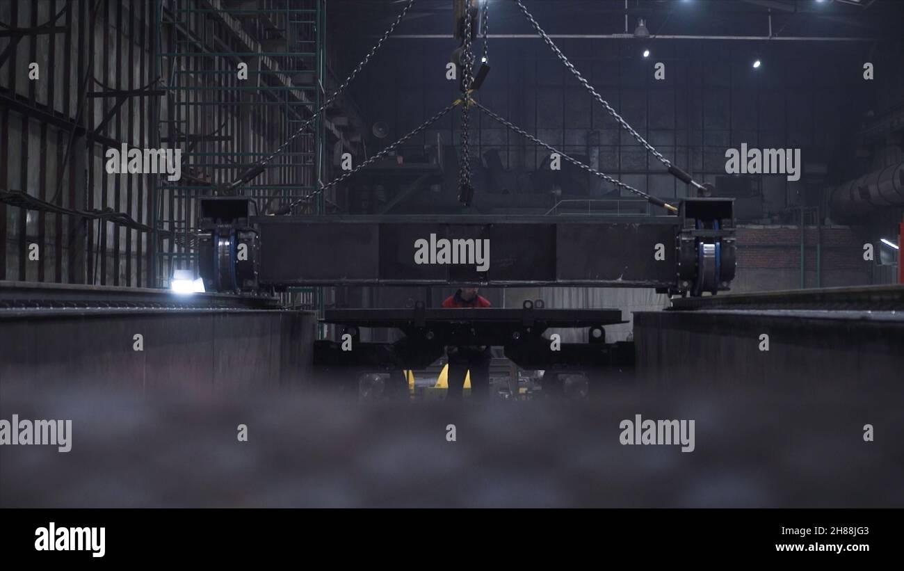 Wagon platform stands on rails at factory. Clip. Metal platform of ...