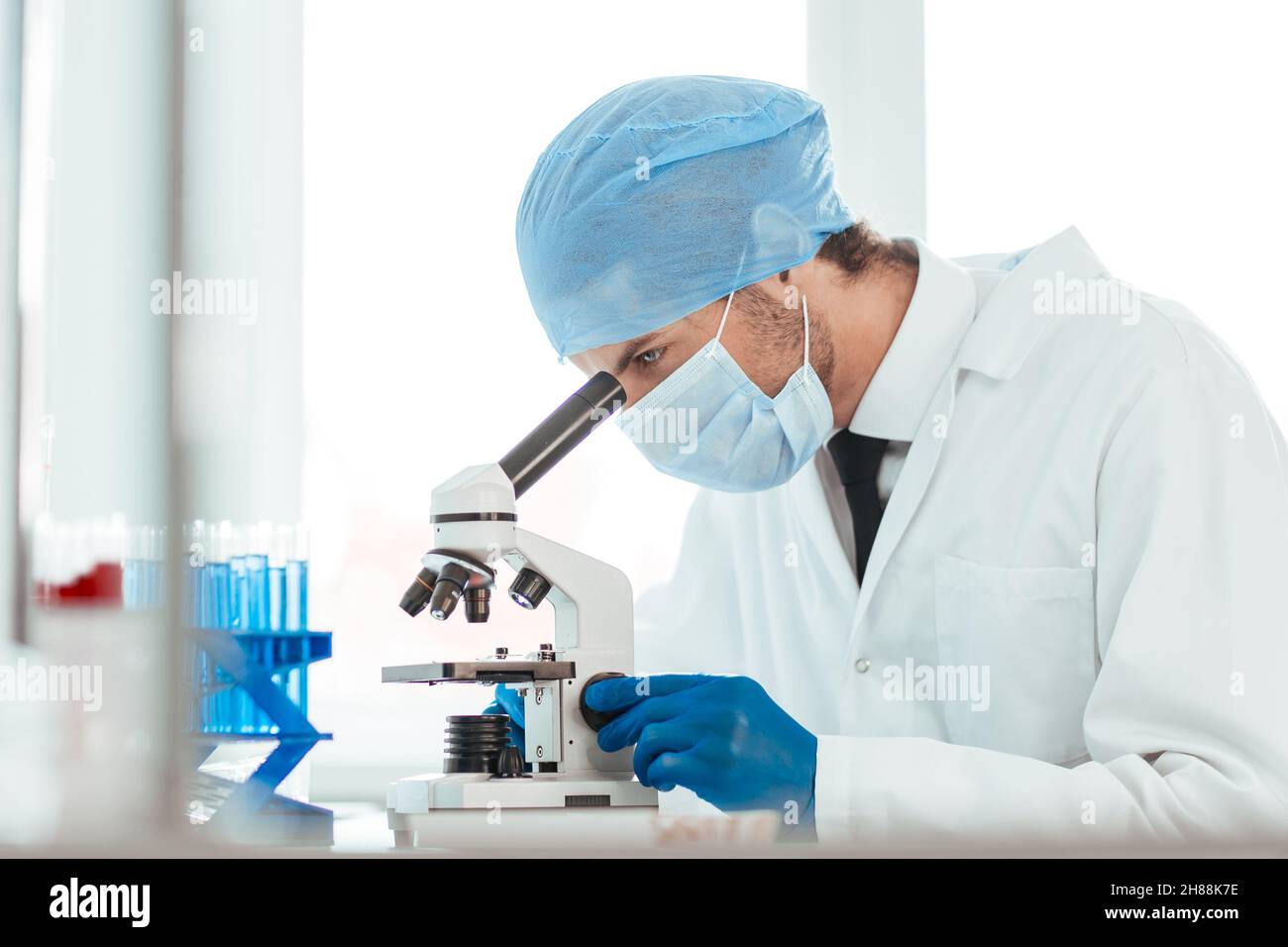 close up. scientist looking into the eyepiece of a microscope Stock ...