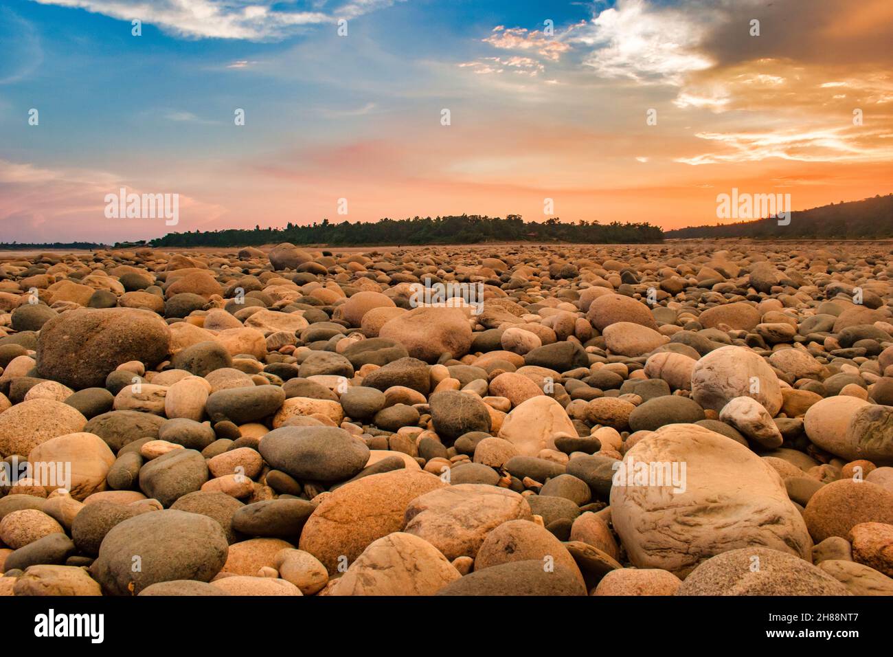 Beautiful riverside stone view in the afternoon with blue sky ...