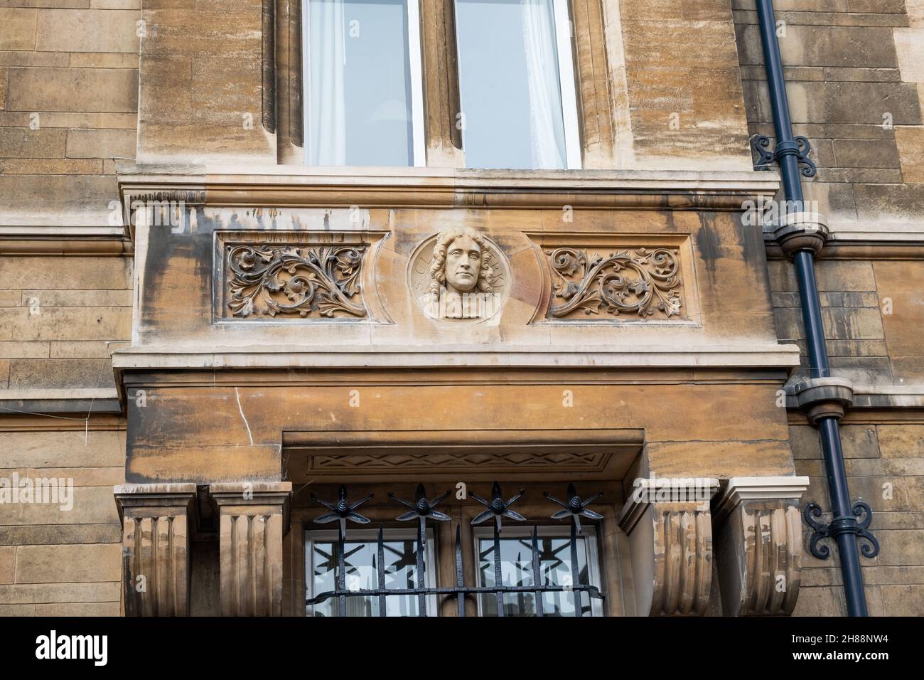 Ornate and decorative statue of a man on the exterior or outside of a ...