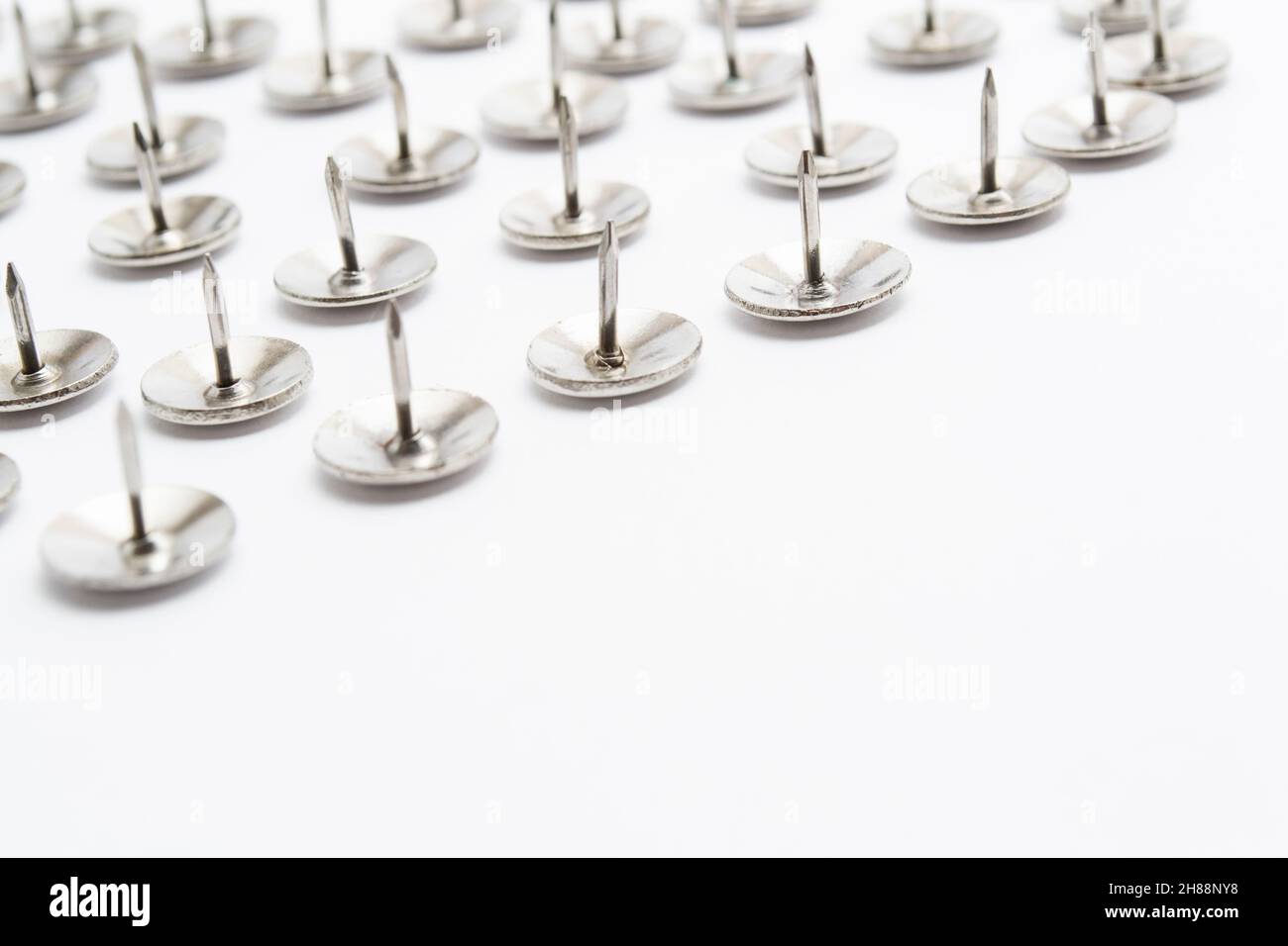 Heap of Metal Pushpin or Drawing Pin isolated on white Stock Photo - Alamy