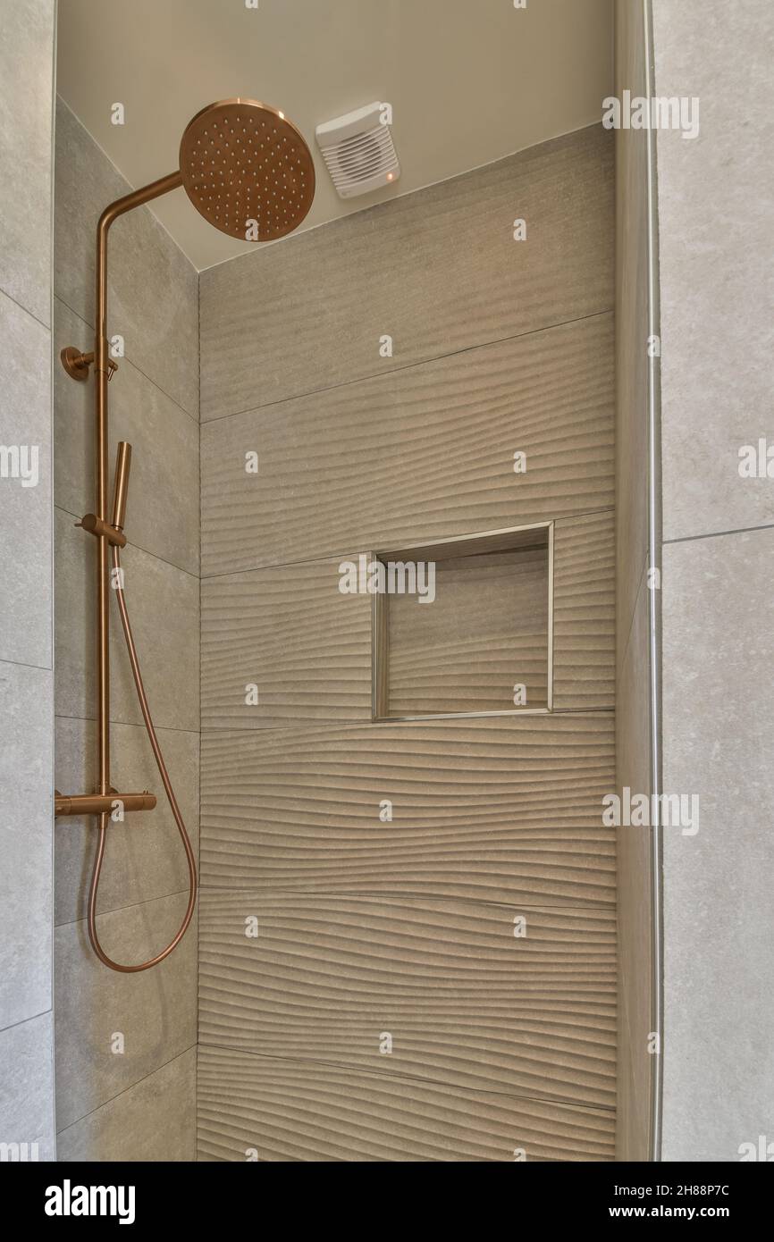 Modern shower cubicle with elegant dark tiles Stock Photo - Alamy
