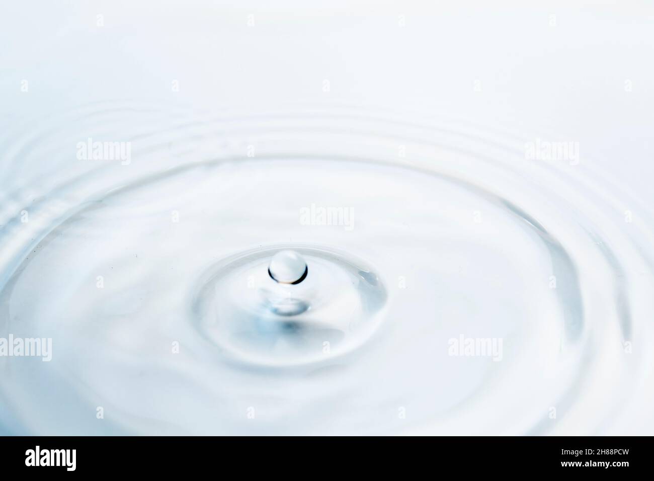 Water drop falling into water making a perfect droplet splash Stock ...