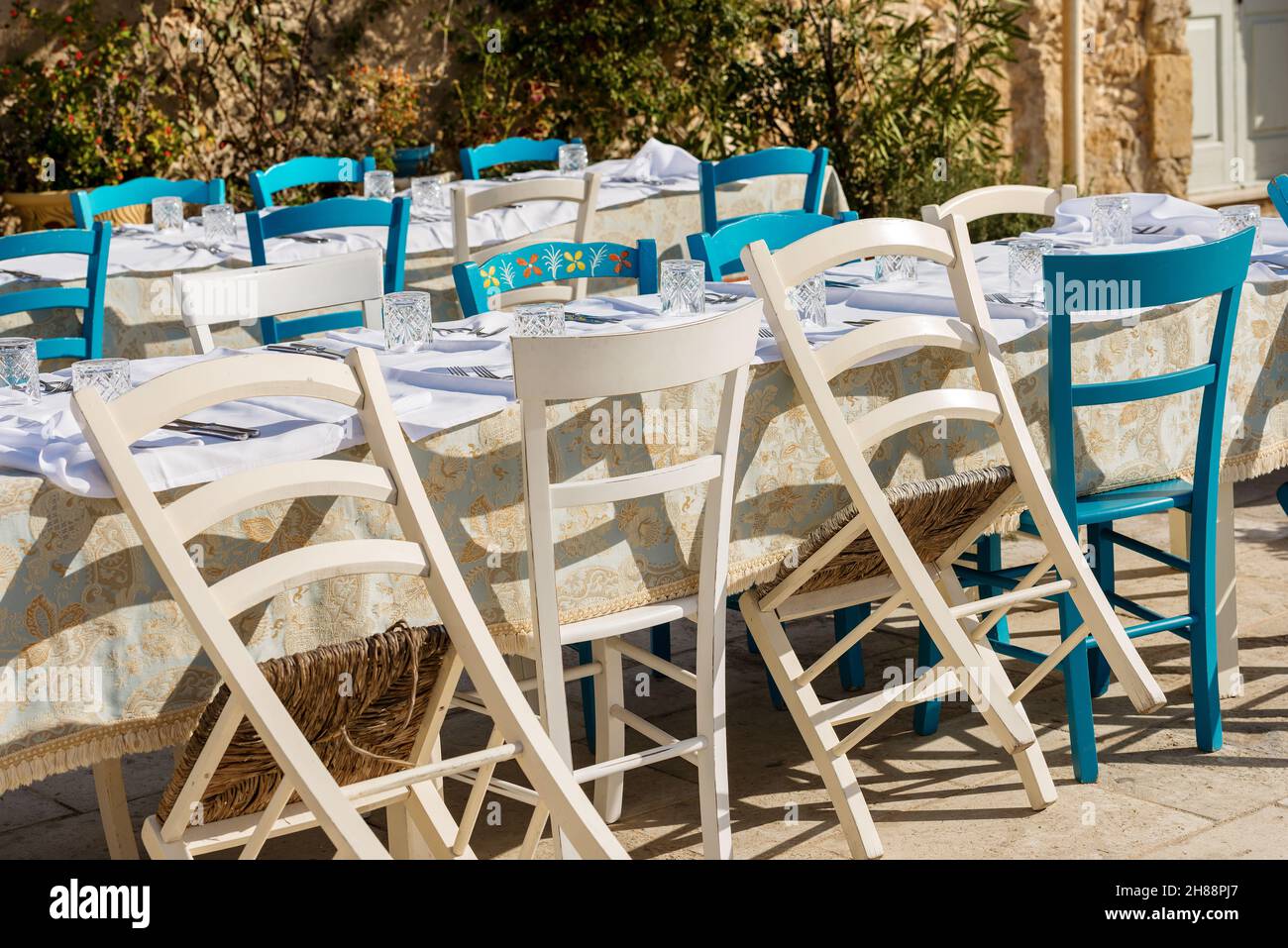 Tables and chairs set up in a traditional Italian restaurant in ...