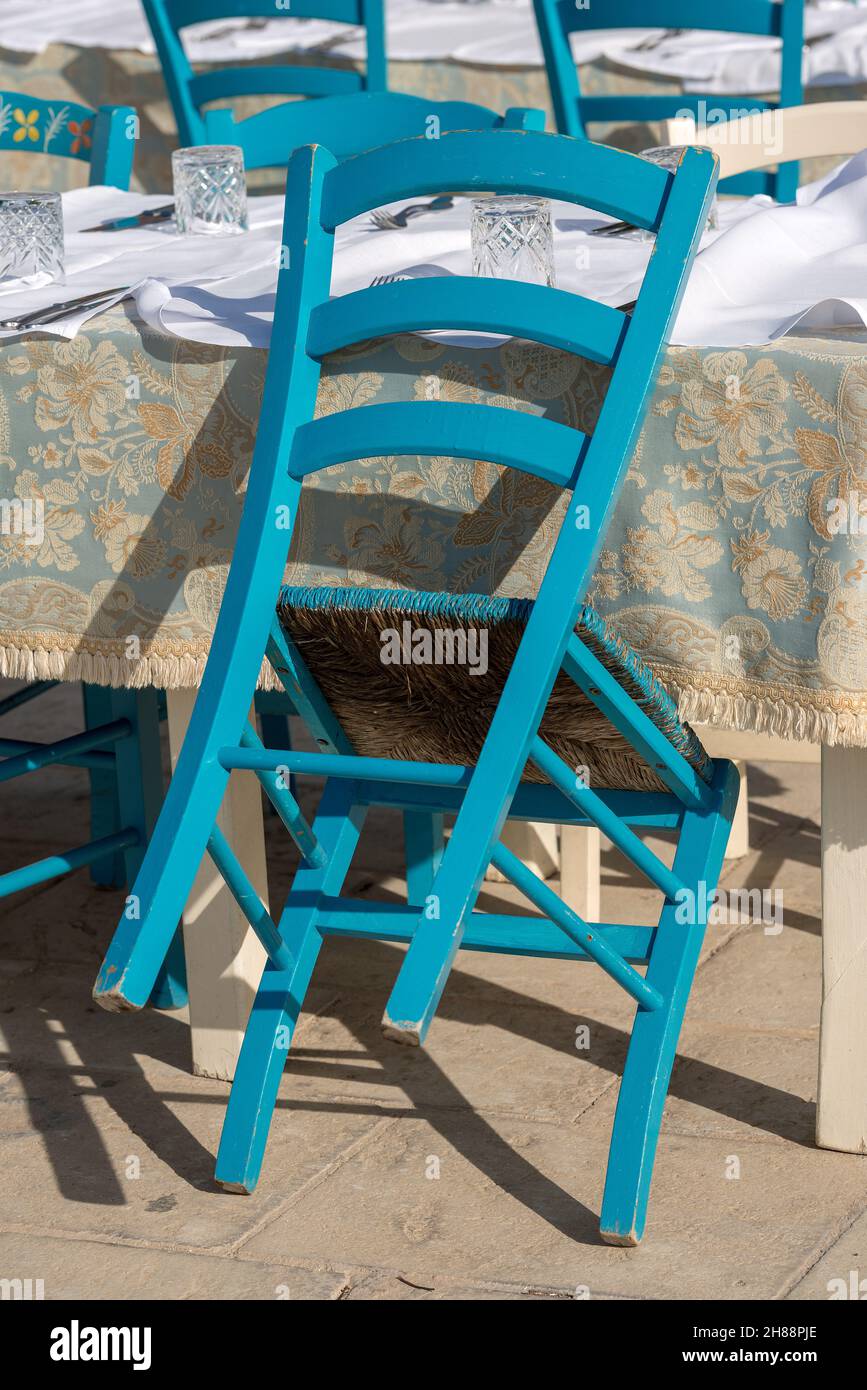 Tables and chairs set up in a traditional Italian restaurant in ...