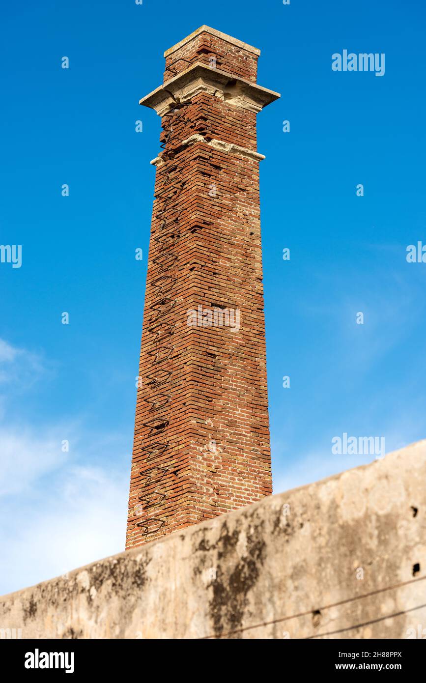 Smokestack of an old industry for processing tuna fish in the small ...