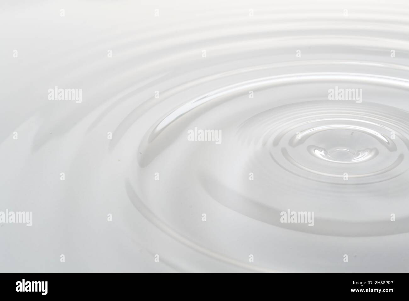 Water drop falling into water making a perfect droplet splash Stock ...