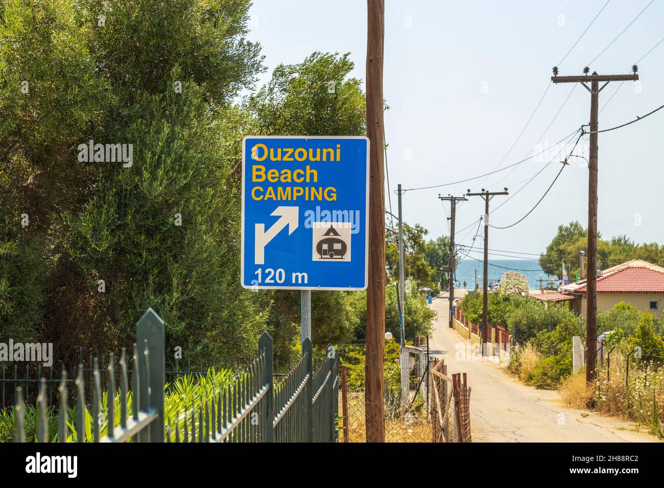 Beautiful view of beach camping road sign on village landscape ...