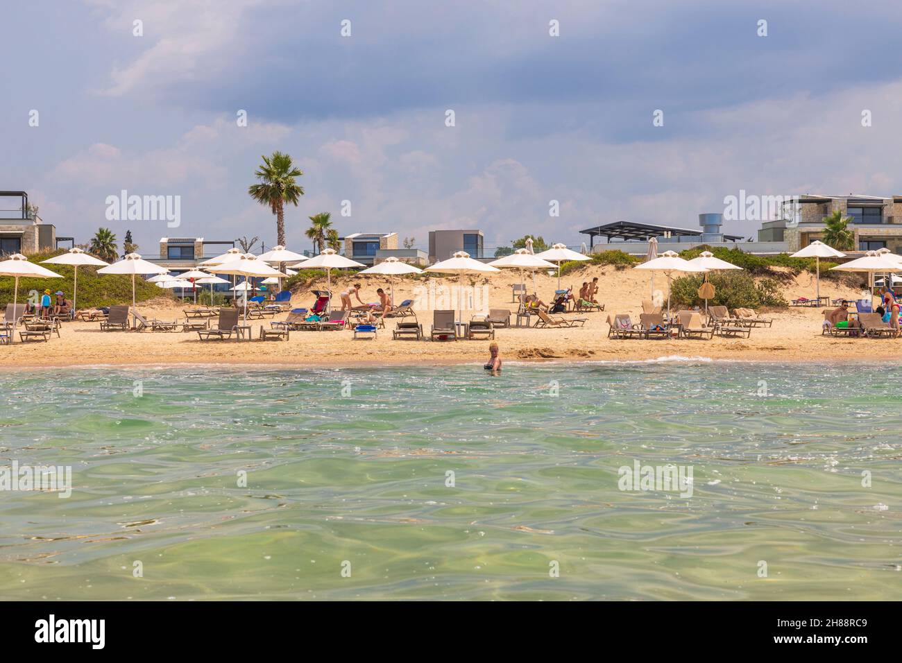 Beautiful colorful view of resort beach on blue sky with white clouds ...