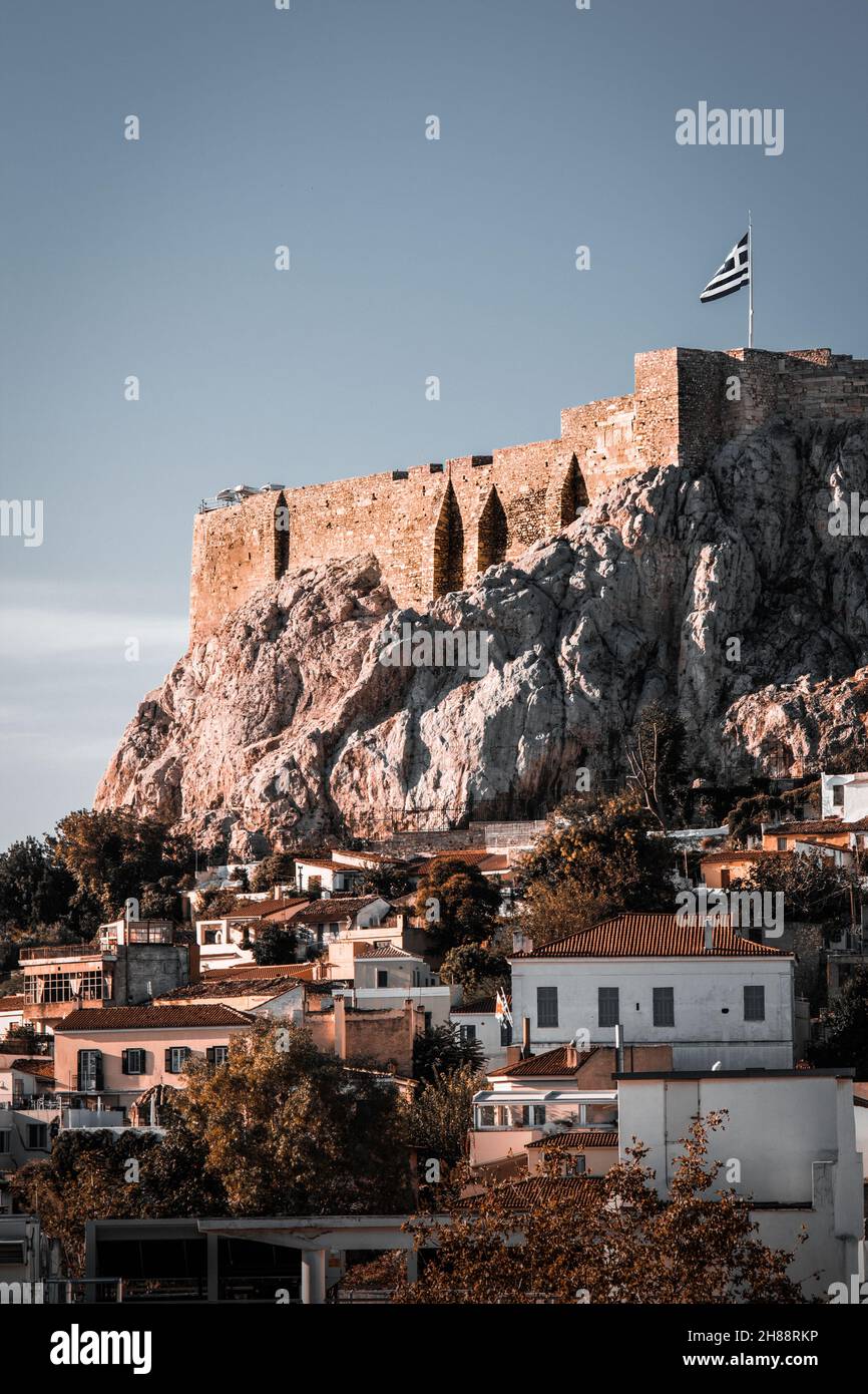 A beautiful sunset over The Parthenon and The Acropolis of Athens atop ...