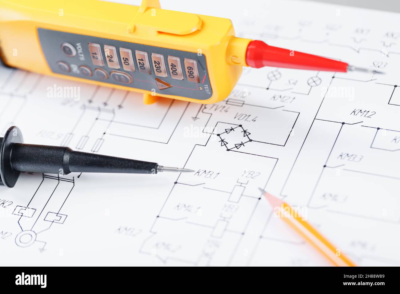 Yellow voltage indicator in close-up on the electrical diagram. Testing ...