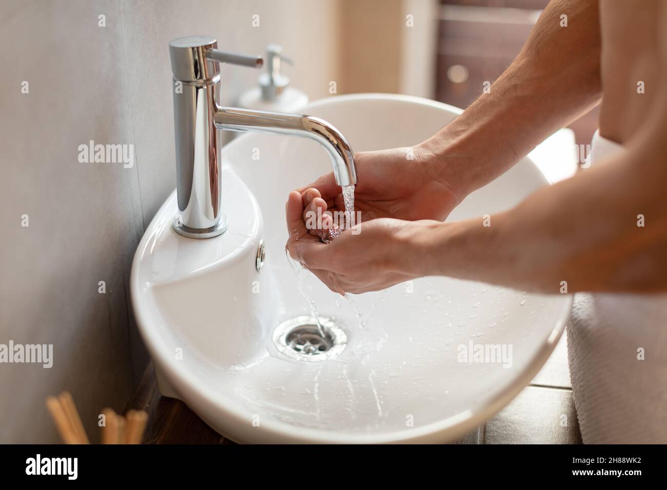 Closeup of man washing his hands at bathroom Stock Photo - Alamy