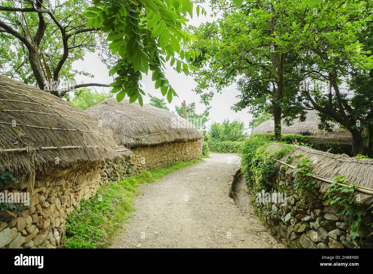 A view of traditional houses with straw roofs the village Stock Photo ...