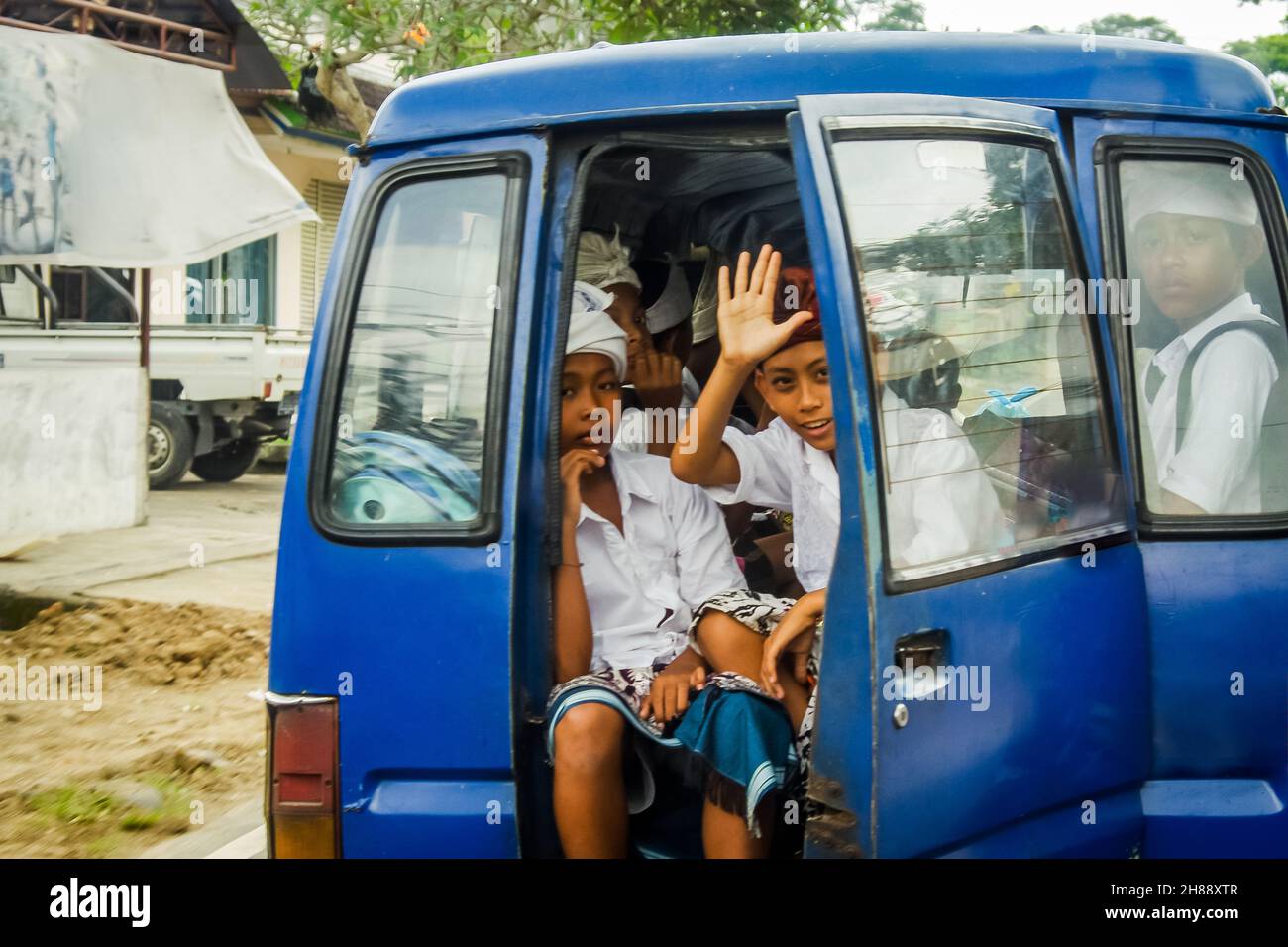 Smiling and happy Asian pupil kids going to school. Students are ...